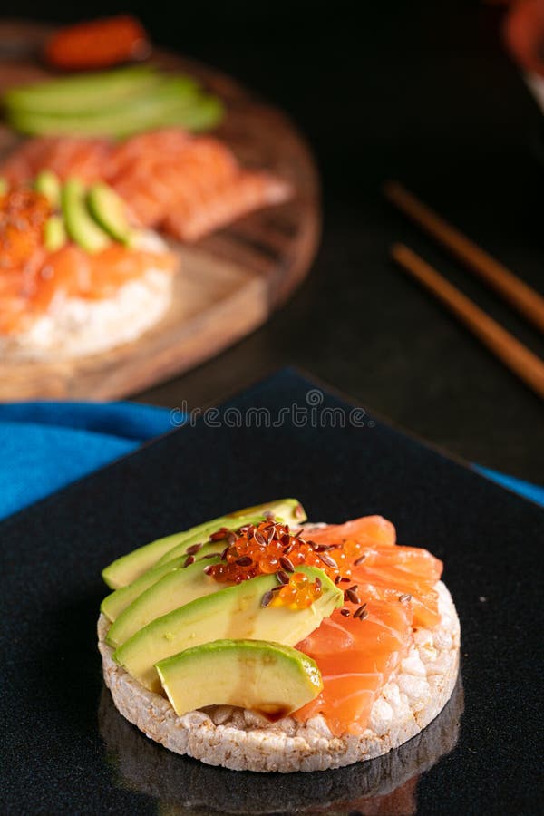 Puffed Rice Spread with Raw Salmon and Avocado Stock Photo - Image of ...