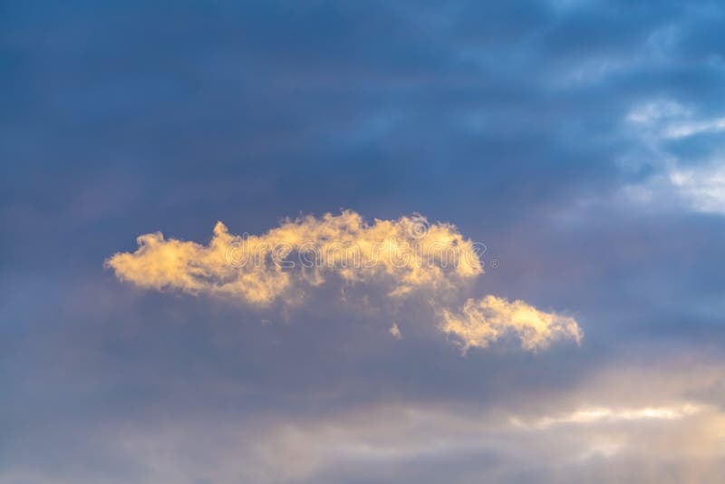 Puffy Clouds Illuminated By Sunlight In The Boundless Blue Sky Stock ...