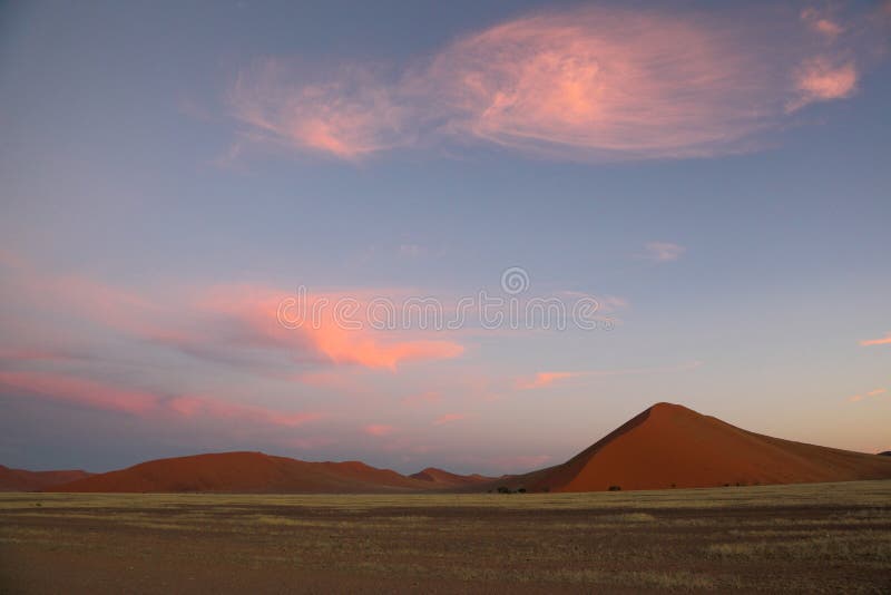 Puffy Pink Clouds Over Red Sand Dunes Stock Photo - Image of sossusvlei ...