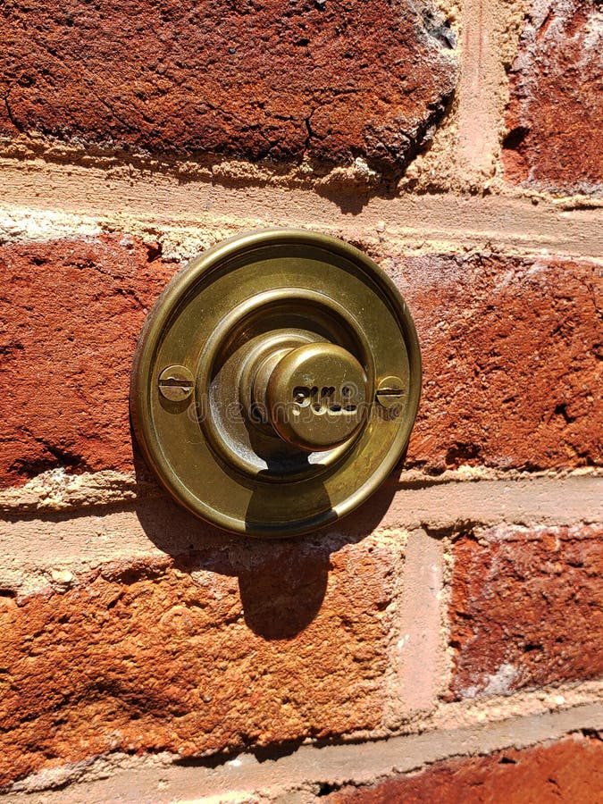 Pull button on brick wall stock photo. Image of bell - 188812658