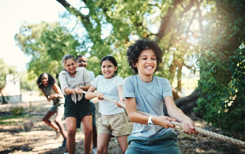 Pull Harder Team. Shot of a Group of Teenagers Playing a Game of Tug of ...