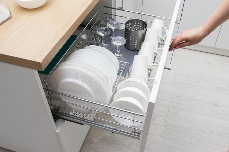 Pull-out Shelf with Dishes in a Modular Kitchen. Modern Kitchen ...