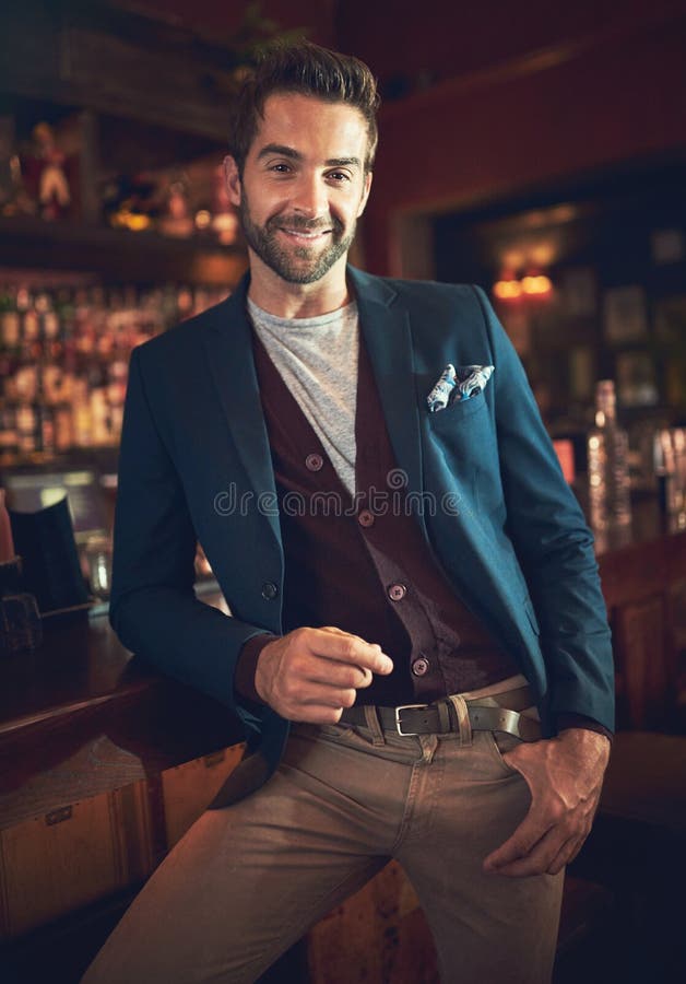 Pull Up a Chair. Cropped Portrait of a Young Man Standing in a Bar ...