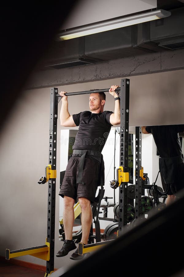 Pull-ups on the Stick. Training in the Gym Stock Photo - Image of ...