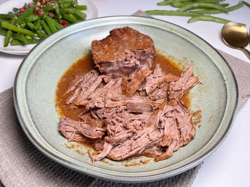 Pulled Beef. Juicy and Tender Beef Stewed with Herbs and Spices in a ...