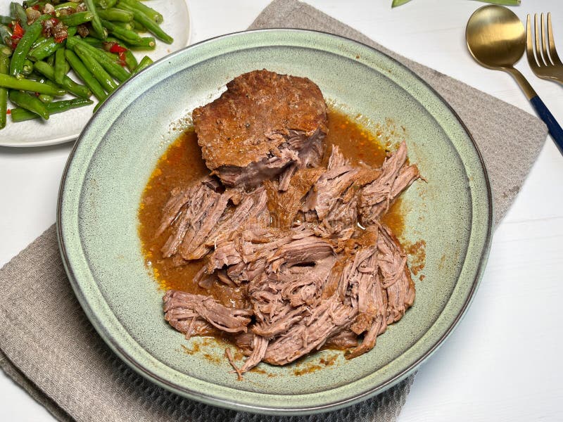 Pulled Beef. Juicy and Tender Beef Stewed with Herbs and Spices in a ...