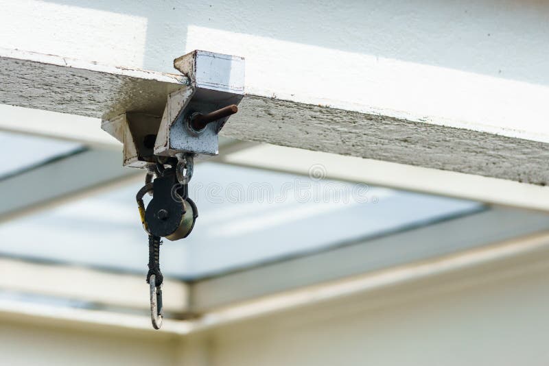 The Pulley is Mounted on the Beam with Glass Roof. Stock Photo - Image ...