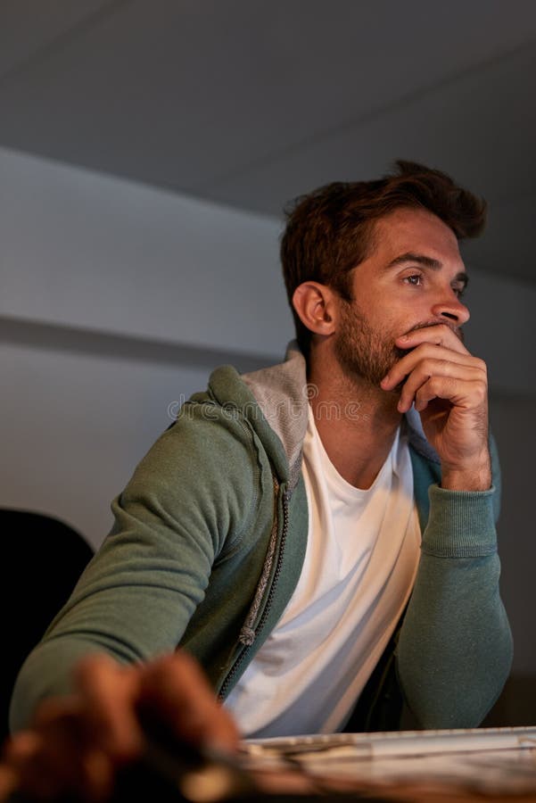 Pulling an All-nighter. a Young Designer Working Late in the Office ...