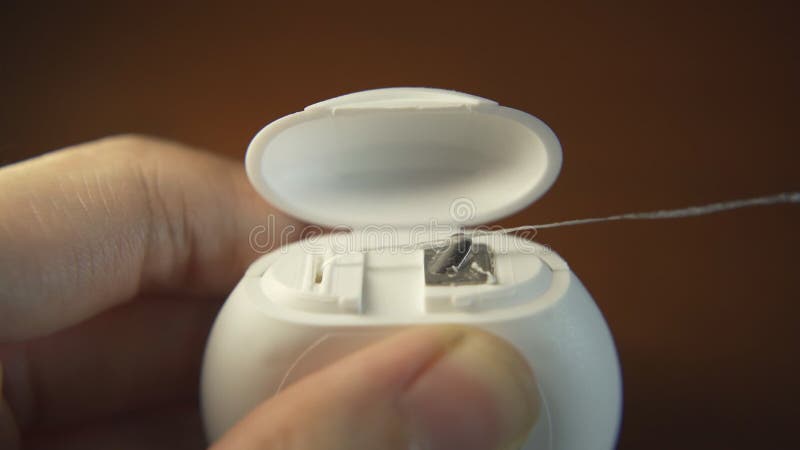 Pulling Dental Floss Out of the Container Stock Video - Video of ...