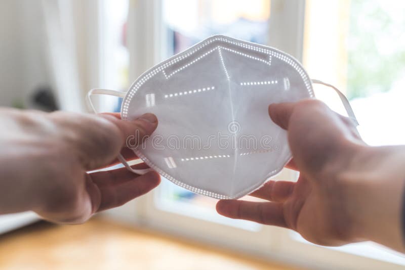 Pulling on Ffp2 Face Mask: Close Up of Ffp2 Mask Stock Photo - Image of ...