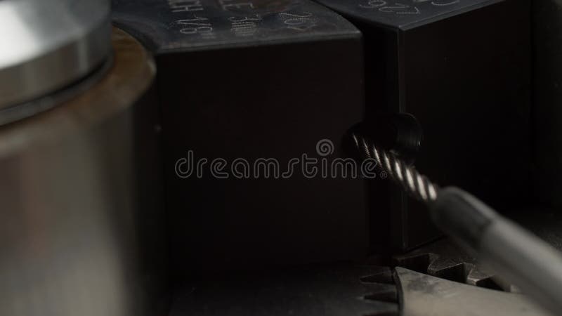 Pulling Metal Wire Rope through Machine Tool with Cog Wheels Stock ...