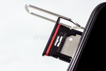 Pulling Out the Phone Sim Card Tray from the Smartphone with the Help ...