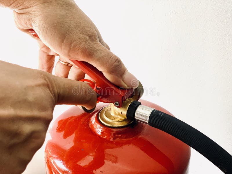 Male Hands Presses the Trigger Fire Extinguisher,Closeup Stock Photo ...