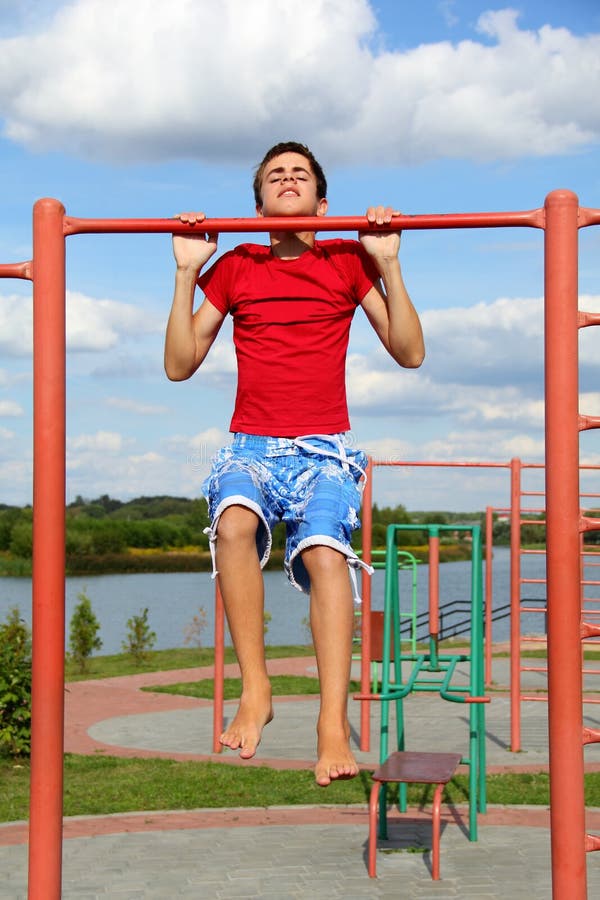 Pulling up on the bar stock image. Image of gorgeous - 26296645