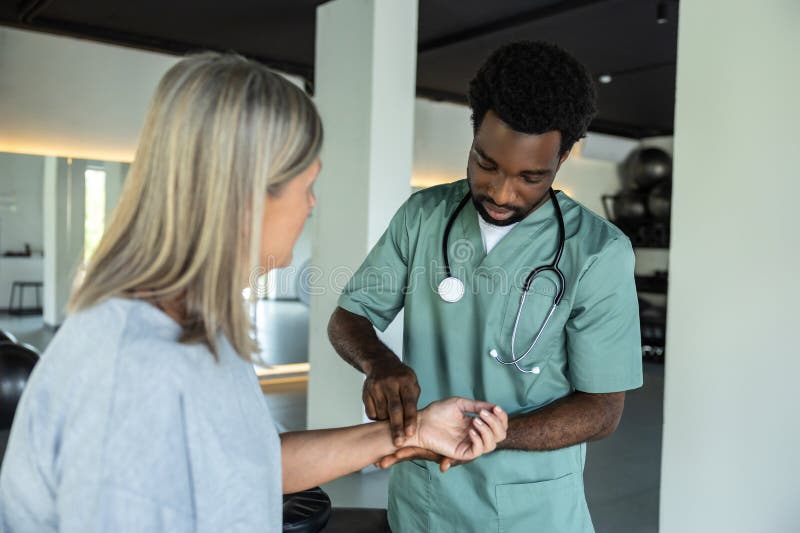 Doctor Checking the Pulse of a Patient in the Clinic Stock Image ...