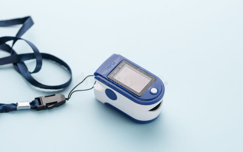 Pulse Oximeter on Blue Background Stock Photo - Image of monitor ...