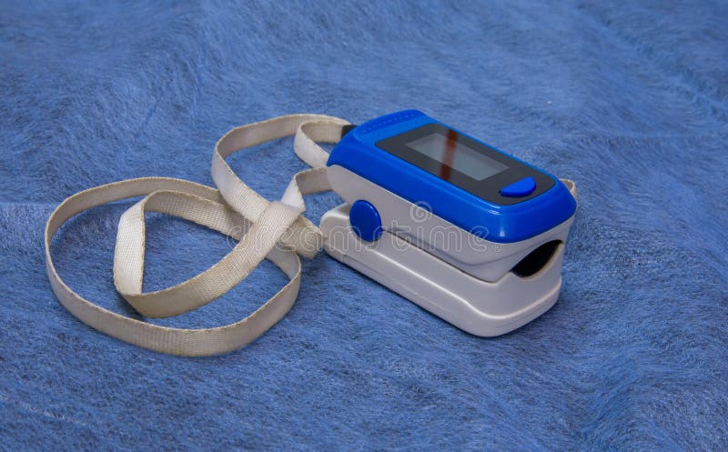 Pulse Oximeter on a Blue Medical Cloth Stock Image - Image of medical ...