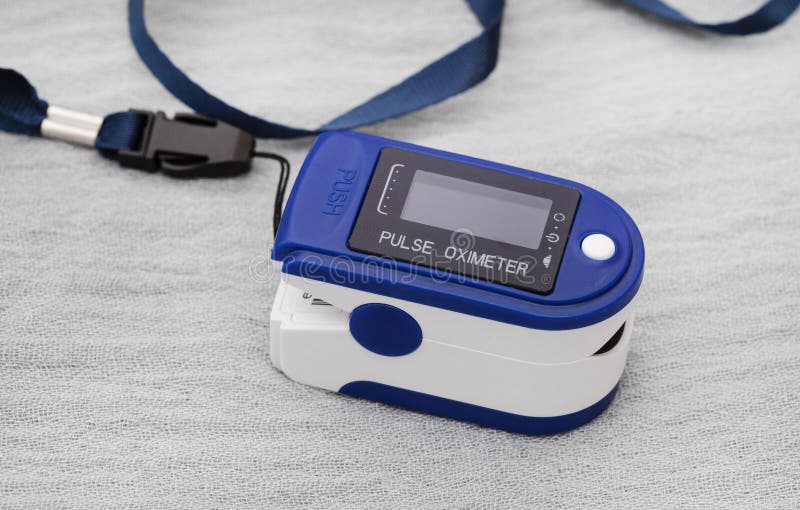 Pulse Oximeter on Light Colored Cloth Stock Photo - Image of white ...
