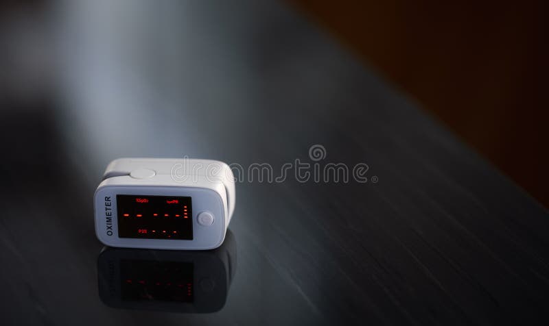 Pulse Oximeter Machine on Grey Table Stock Image - Image of health ...