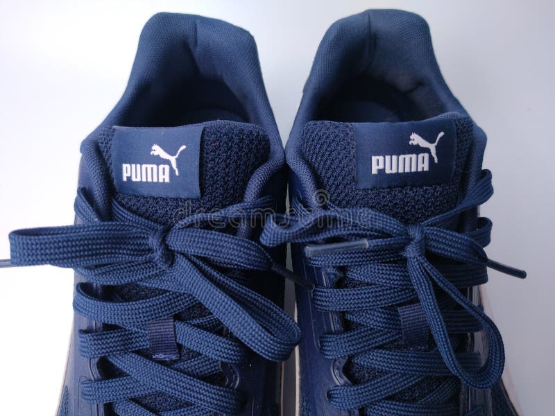 Puma Blue Shoes on a White Background Editorial Stock Image - Image of ...