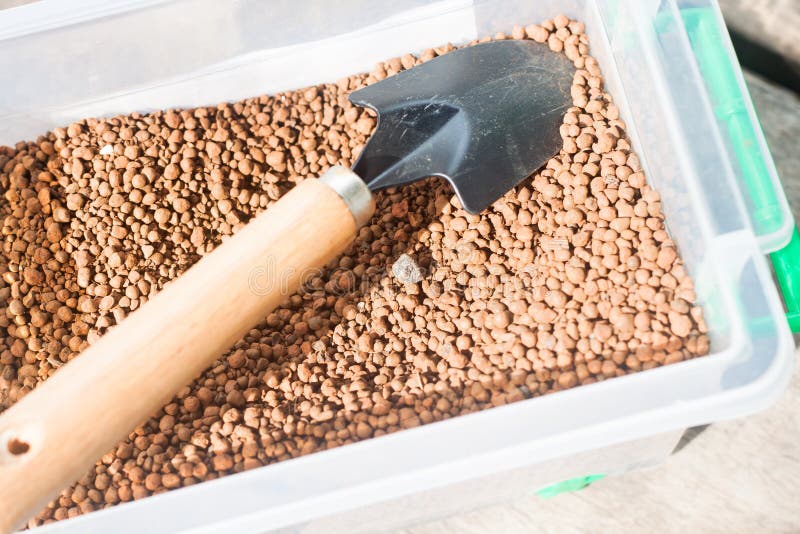 Pumice Pebbles in Bucket and Gardening Tool Stock Image - Image of ...