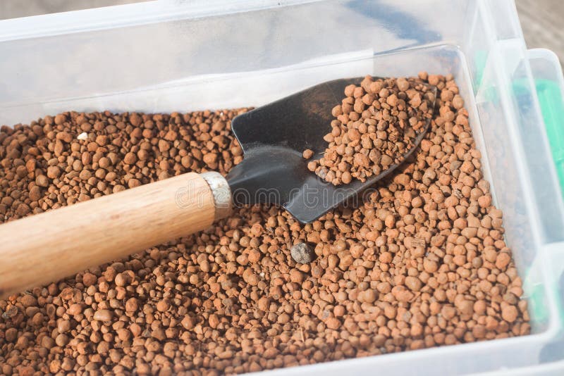 Pumice Pebbles in Bucket and Gardening Tool Stock Photo - Image of ...