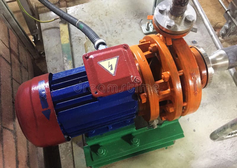 Pump and Engine at an Industrial Facility. Caution the Equipment in ...