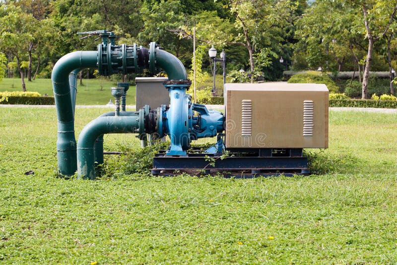 Pump on the grass stock photo. Image of pipe, plumbing - 33873322