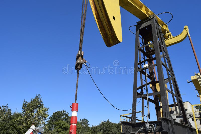 Pumping Unit As the Oil Pump Installed on a Well Stock Photo - Image of ...