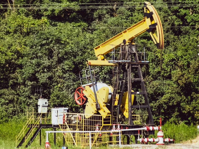 Pumping Unit As the Oil Pump Installed on a Well Stock Image - Image of ...