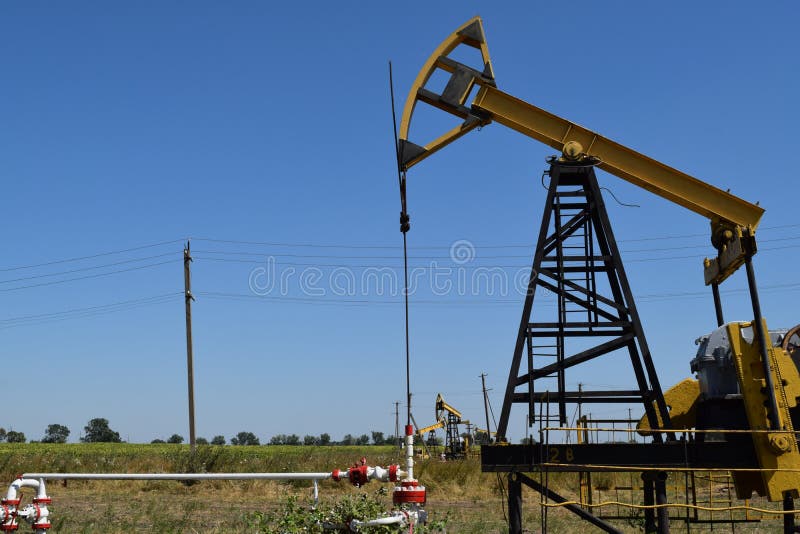 Pumping Unit As the Oil Pump Installed on a Well Stock Image - Image of ...
