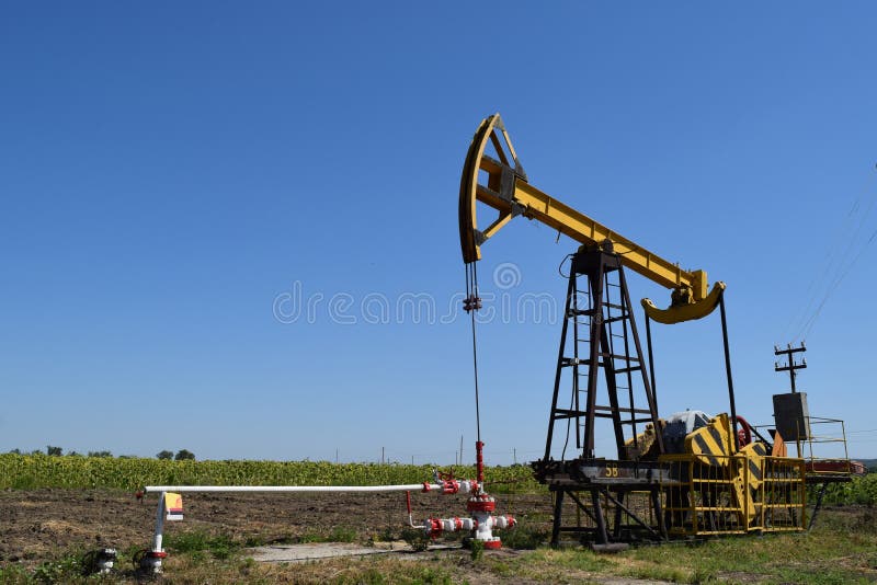 Pumping Unit As the Oil Pump Installed on a Well Stock Image - Image of ...