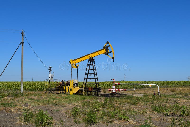 Pumping Unit As the Oil Pump Installed on a Well Stock Image - Image of ...