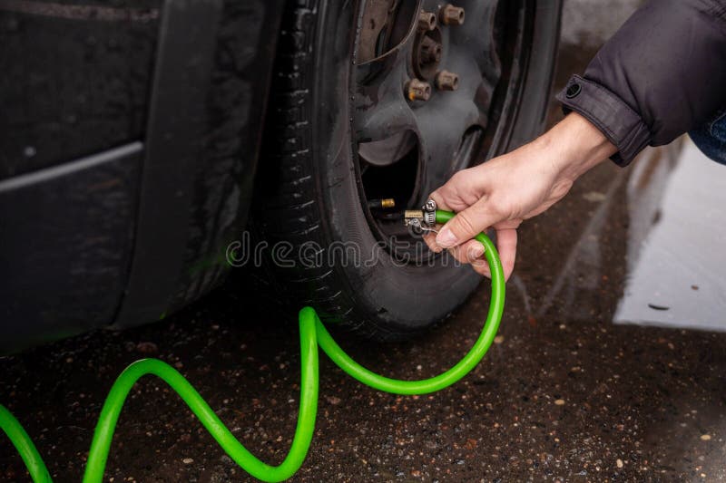 Pumping Up the Wheels of the Machine with a Pump Stock Photo - Image of ...