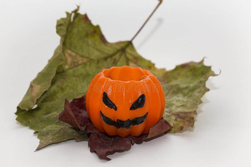 Pumpkin Candle and Rusty Leafs Stock Photo - Image of night, yellow ...