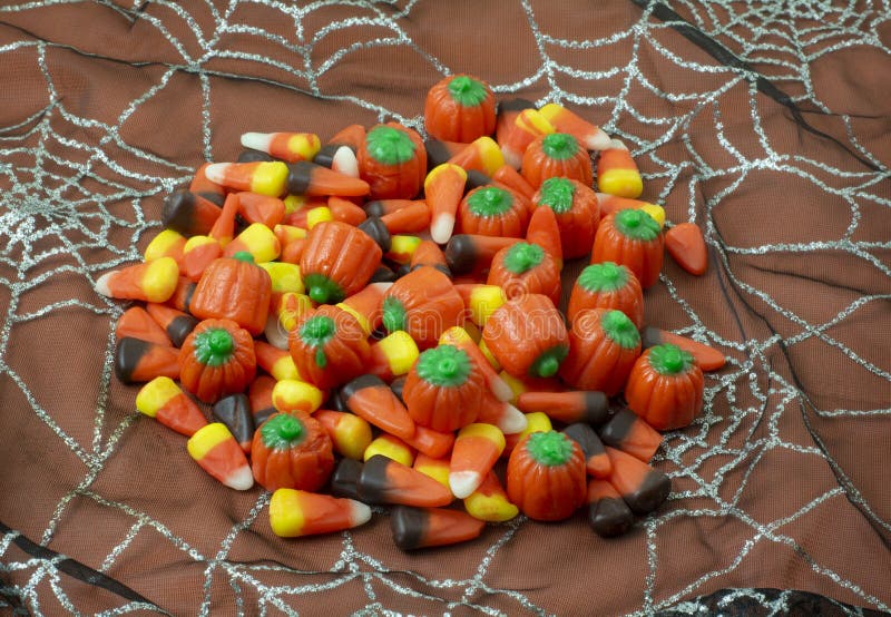 Halloween Candy on Spider Web Fabric Stock Photo - Image of pile, candy ...