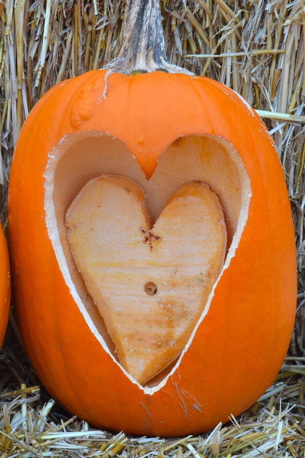 Pumpkin Carved Heart on Haystack Stock Photo - Image of outdoor ...
