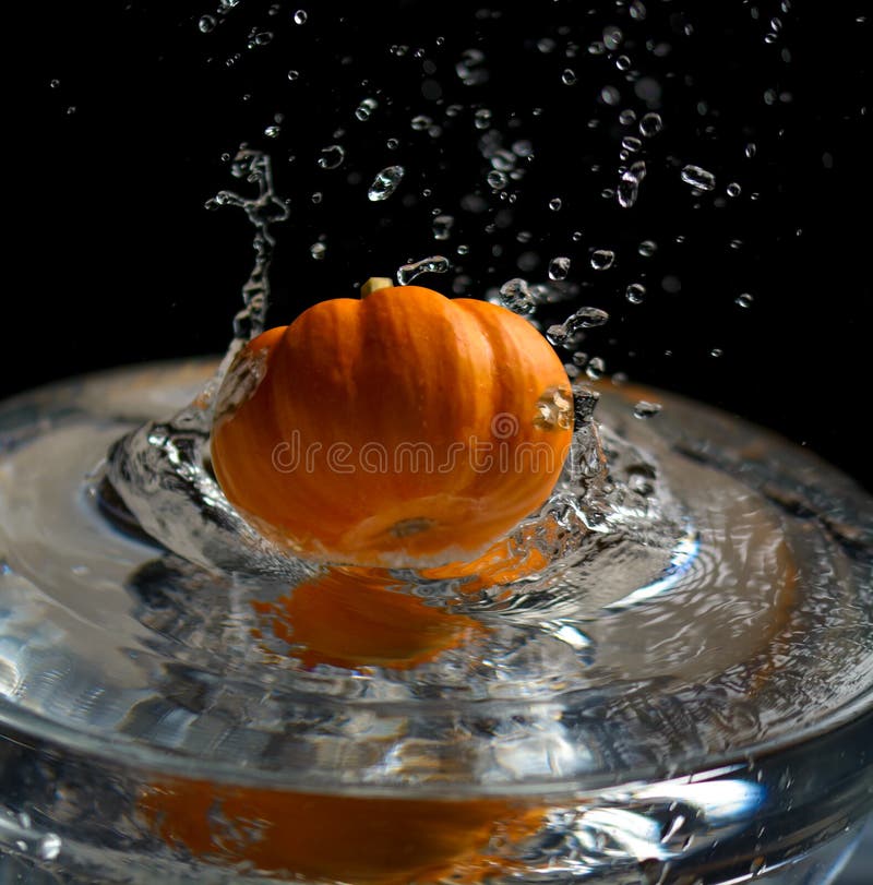 Pumpkin falling in water stock image. Image of pumpkin - 102518349