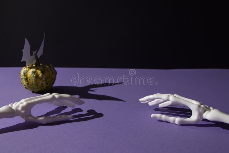 Pumpkin for Helloween and Shadow of Bat and Hand Bones on Purple Black ...
