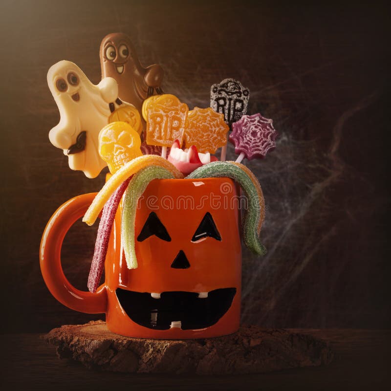 Pumpkin mug with sweets stock image. Image of childhood - 126935151