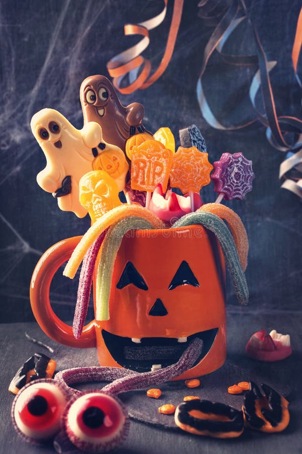 Pumpkin mug with sweets stock image. Image of ghost - 126935247