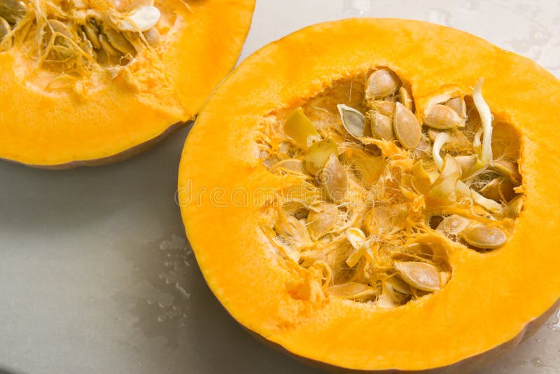 Close-up of a Pumpkin Split in Half that Has Seeds Stock Image - Image ...