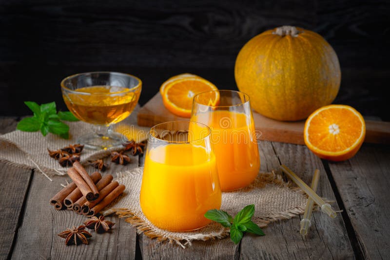 Pumpkin and Orange Spiced Fall Cocktail with Cinnamon Stock Photo ...