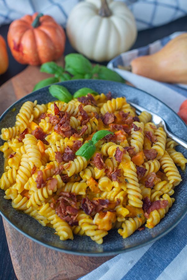 Pumpkin Pasta with Fresh Herbs and Bacon Stock Photo - Image of health ...