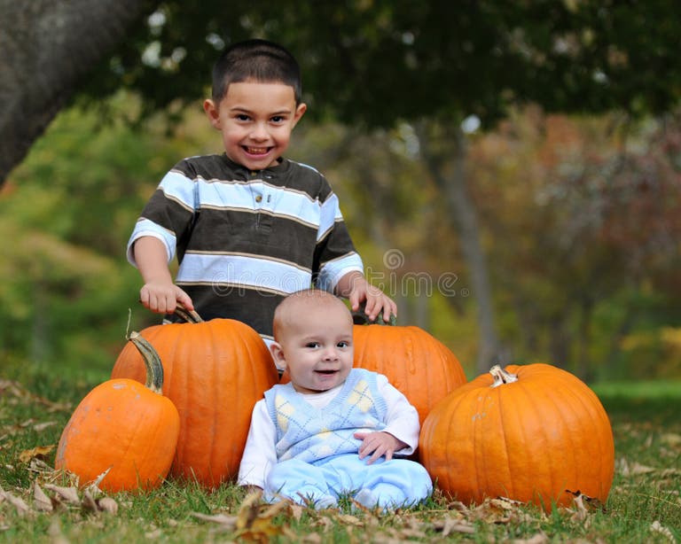 Pumpkin Pose stock photo. Image of fall, propped, kneel - 21647442