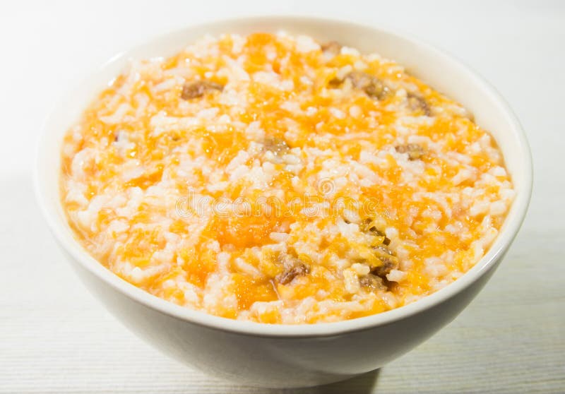 Pumpkin Rice Porridge with Raisins in a Bowl Stock Photo - Image of ...