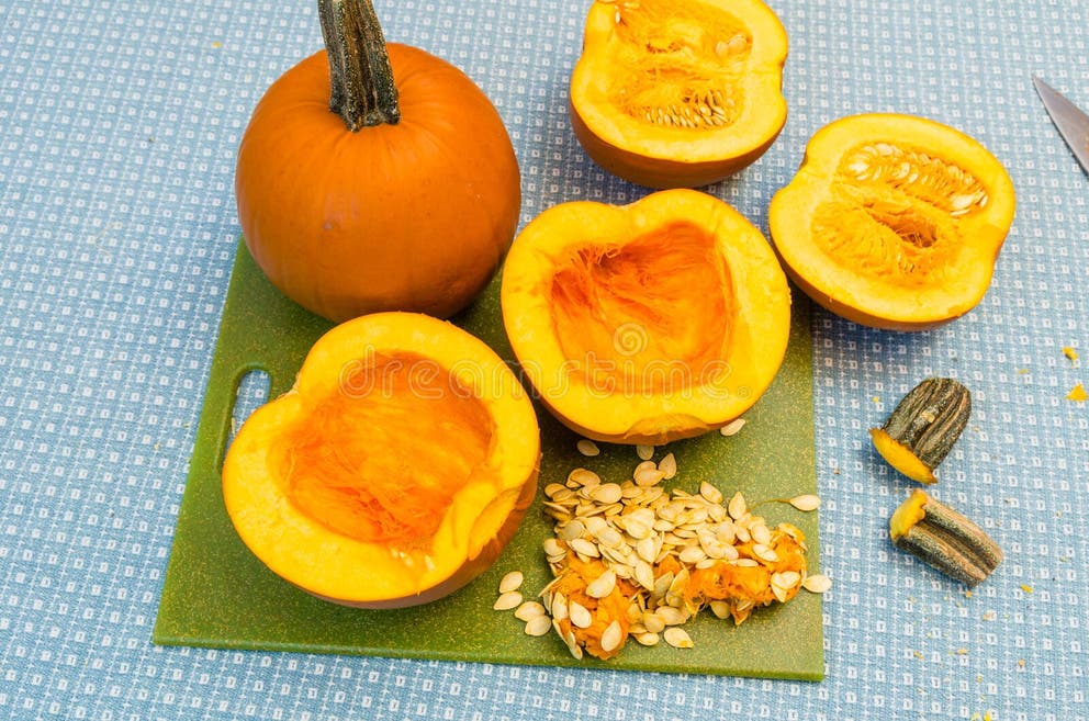 Pumpkins Cut in Half To Extract the Seeds Stock Photo - Image of pumpkins, cooking: 35104740