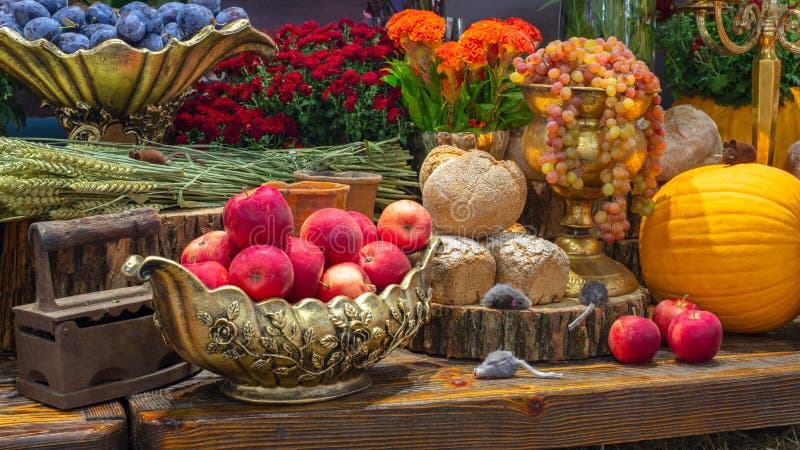 Pumpkins with Fruits, Bread, Vegetables, Grapes and Flowerson Rustic ...