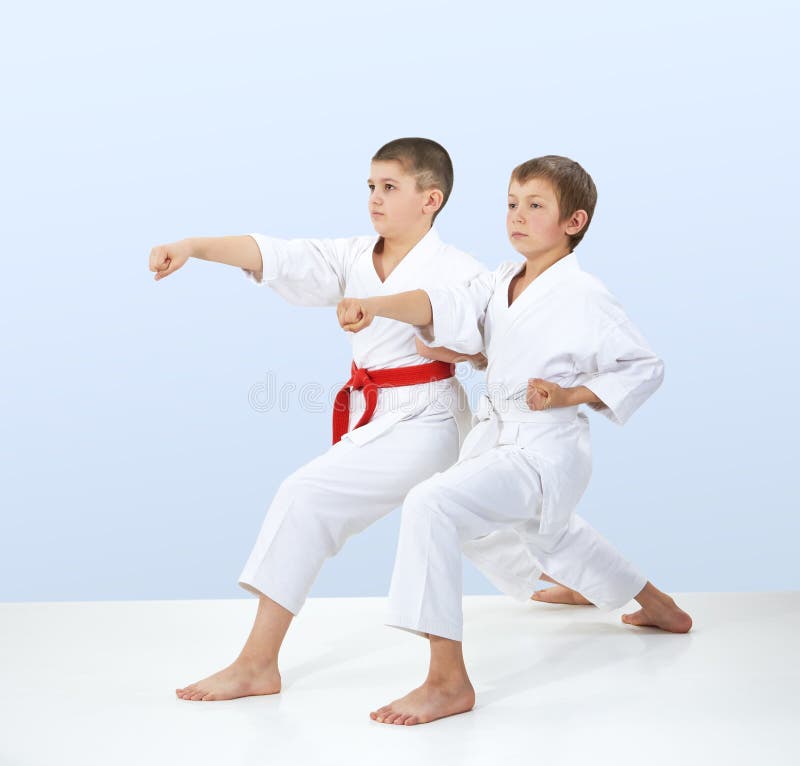 Punch Arm Athletes are Beating in Karategi Stock Image - Image of ...