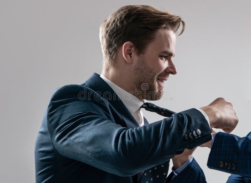 Punch Given in Response. Professional Man Punch Being Pulled by Necktie ...